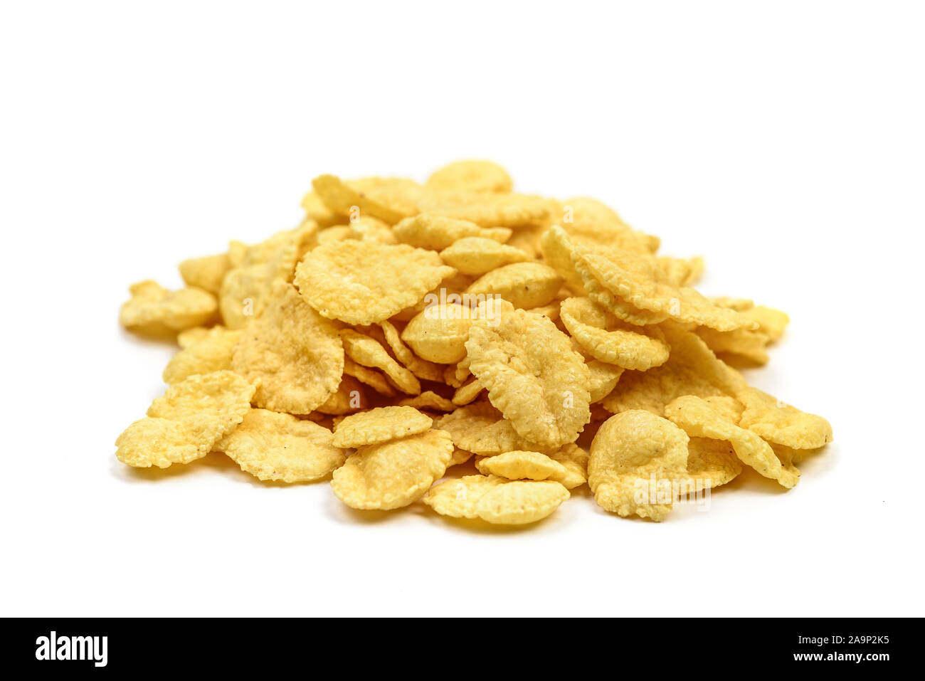 Cornflakes isolated close up. Pile of corn flakes on white background ...