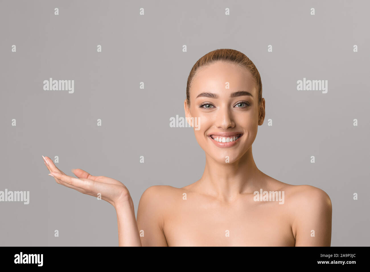 Woman showing something on hi-res stock photography and images - Alamy