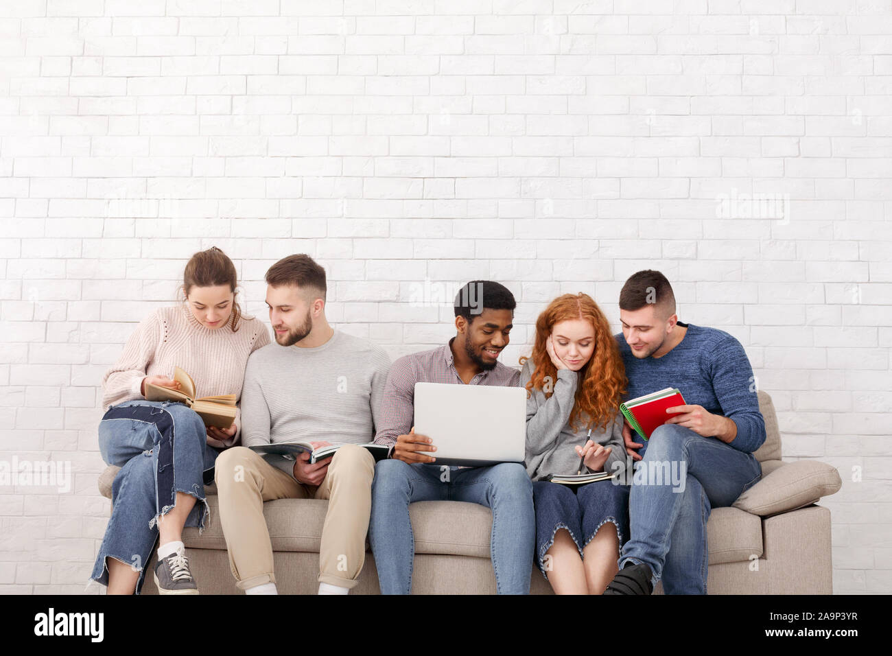 Teamwork concept. Friends preparing for exams together Stock Photo - Alamy