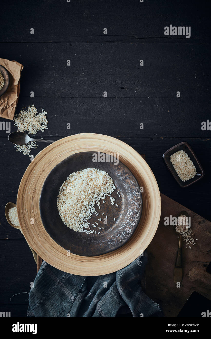 Rice of different varieties on wooden background Stock Photo - Alamy