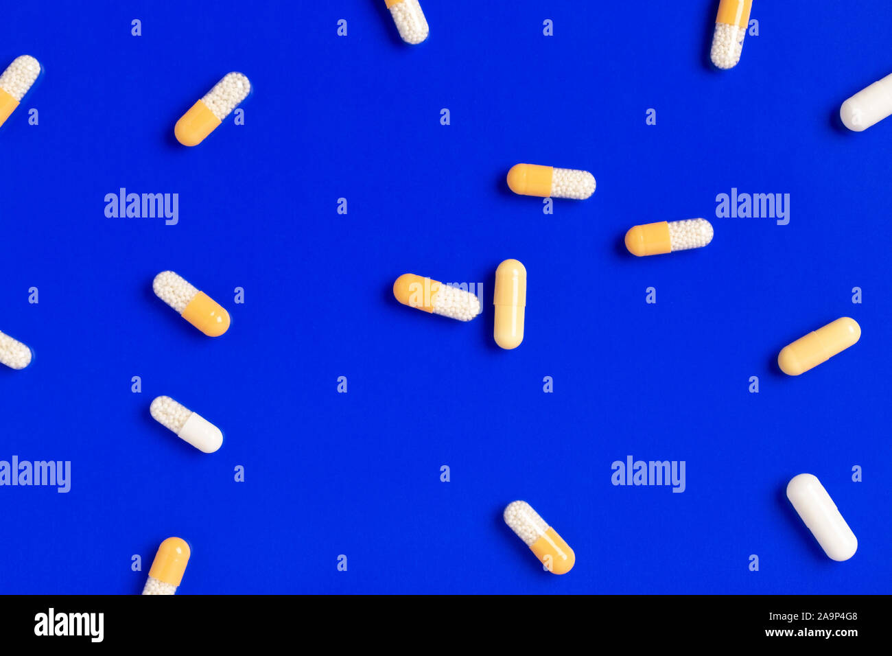 Colorful medicine pills capsules on a single color background Stock ...