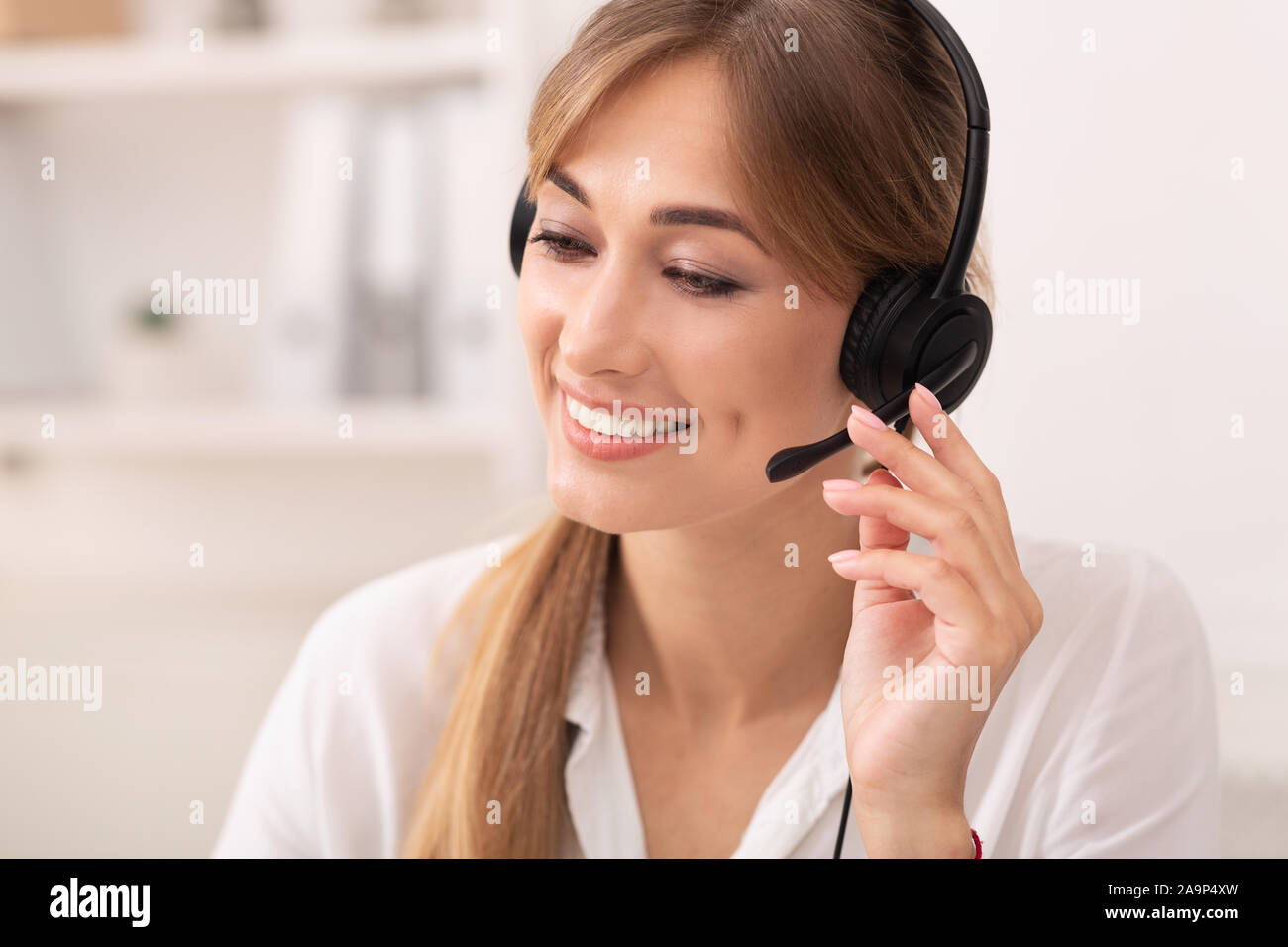 Call Center Worker In Headset Receiving Client's Feedback Sitting ...