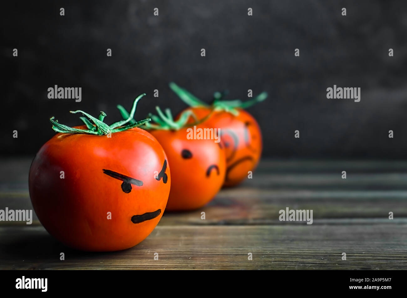 negative emotions on tomatoes. copy space. Angry, sad fear Stock Photo ...