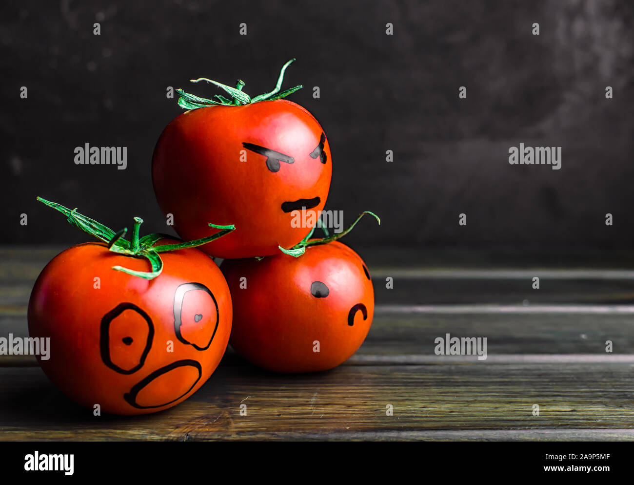 negative emotions on tomatoes. copy space. Angry, sad fear Stock Photo ...