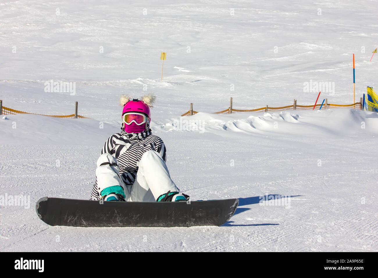 Snowboarding girl on the mountain slope Stock Photo - Alamy