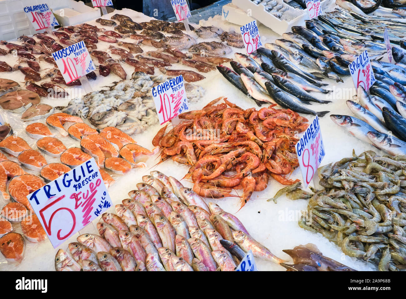 Red mullet, salmon and other fish and seafood for sale at a market in ...