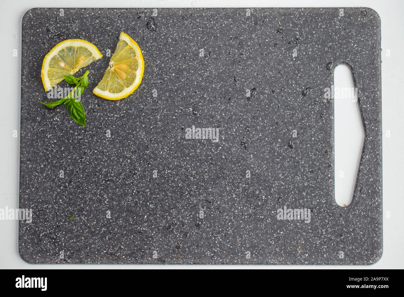 Lemon slices on a gray background with empty place Stock Photo - Alamy