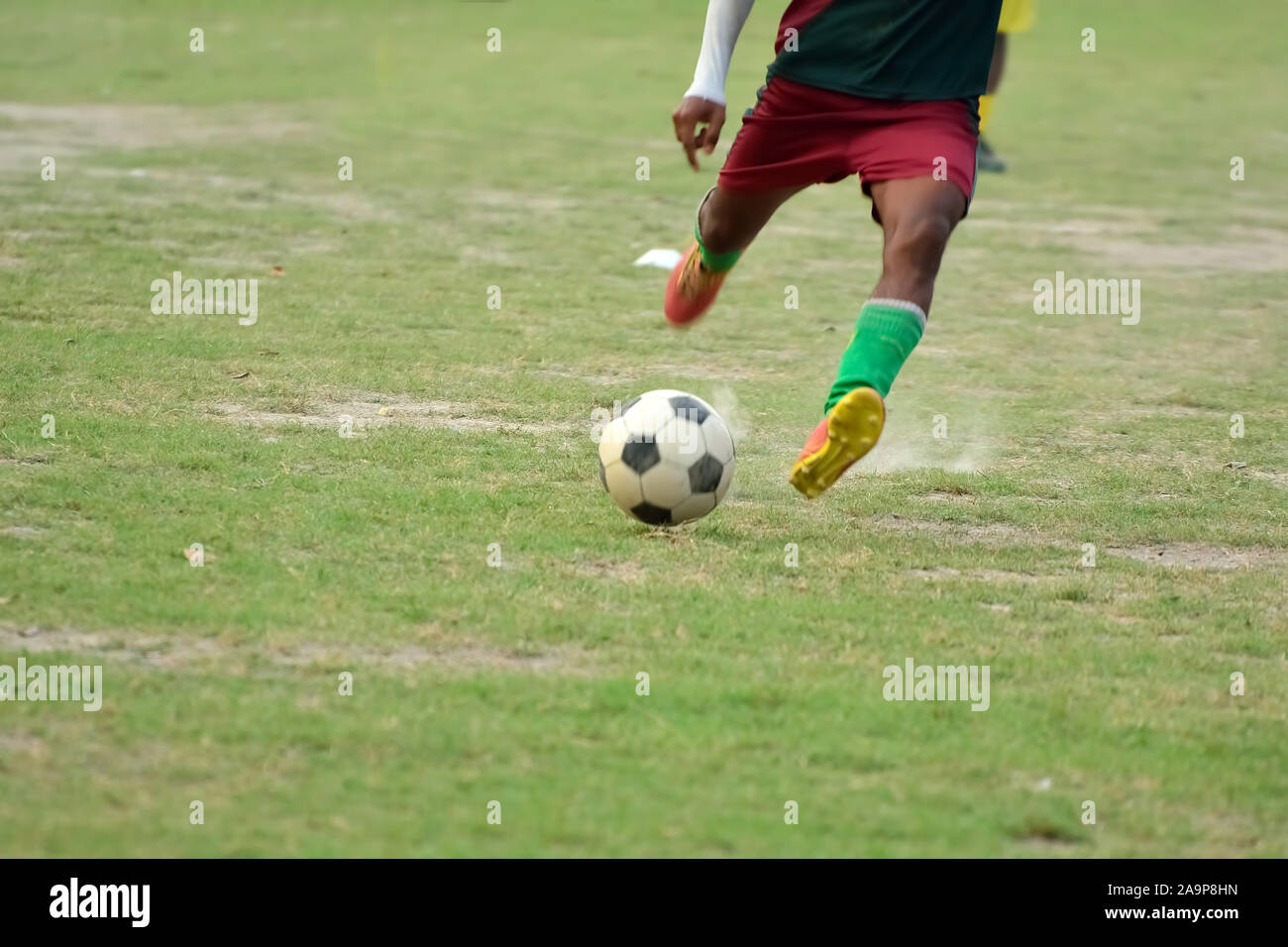 Professional sportsperson practicing football grass hi-res stock ...