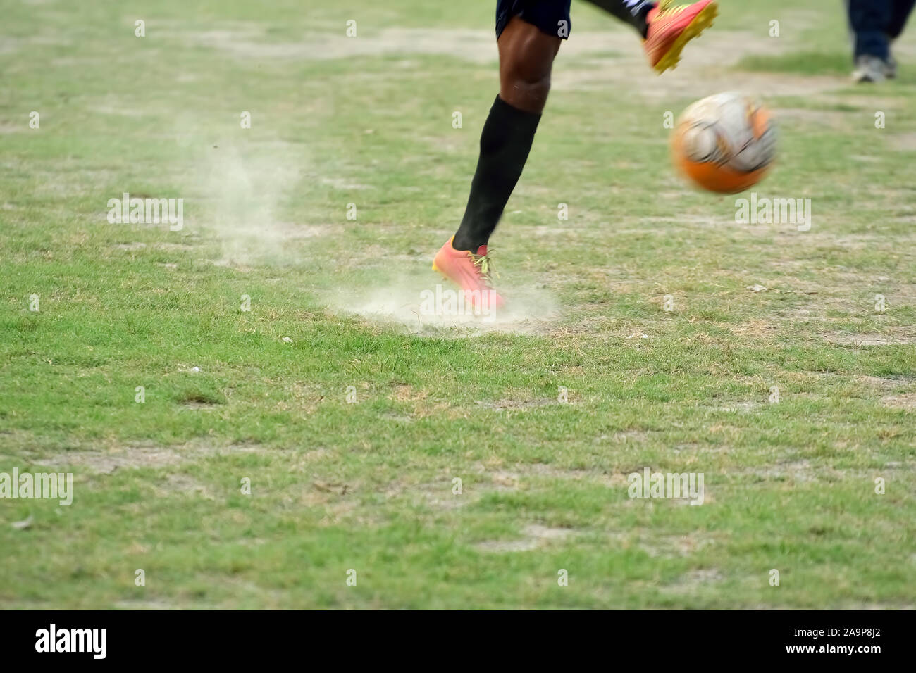 Professional sportsperson practicing football grass hi-res stock ...
