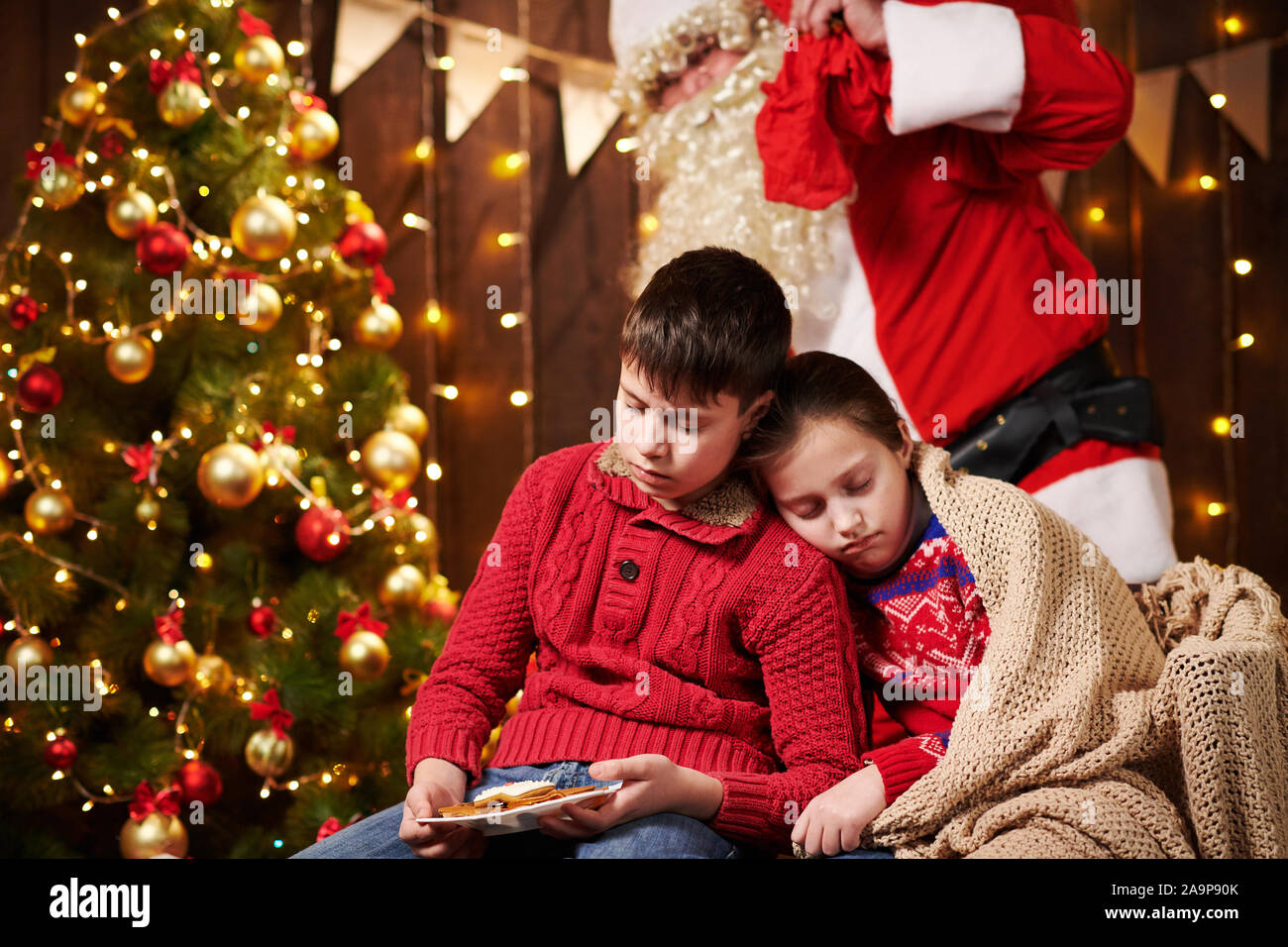 The children waited a long time for Santa, now they fell asleep and ...