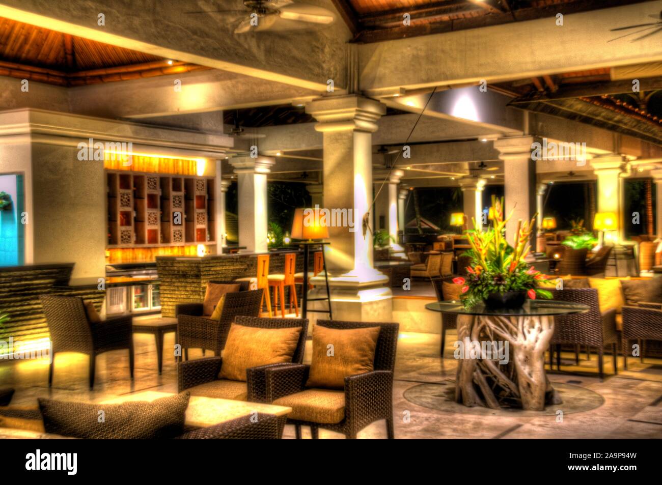 lounge bar interior with tables and chairs and couches at night Stock ...