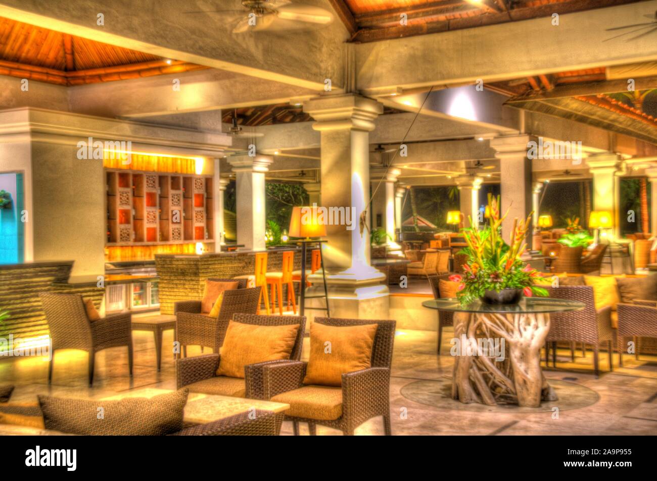 lounge bar interior with tables and chairs and couches at night Stock ...
