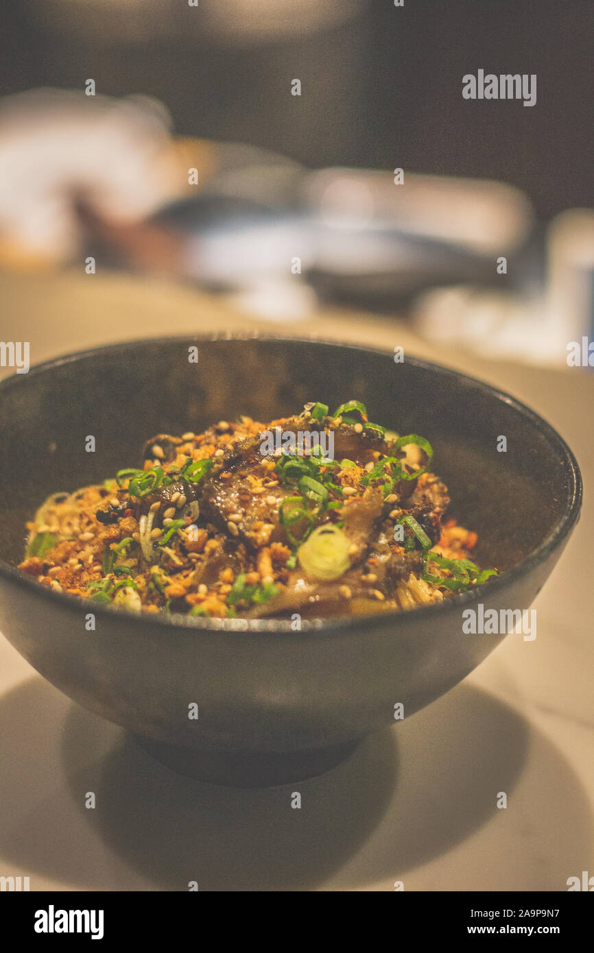 japanese Awabi somen with shallot emulsion in a black bowl Stock Photo ...