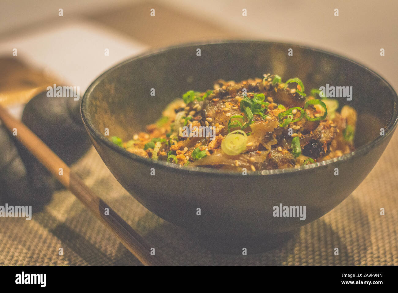 japanese Awabi somen with shallot emulsion in a black bowl Stock Photo ...