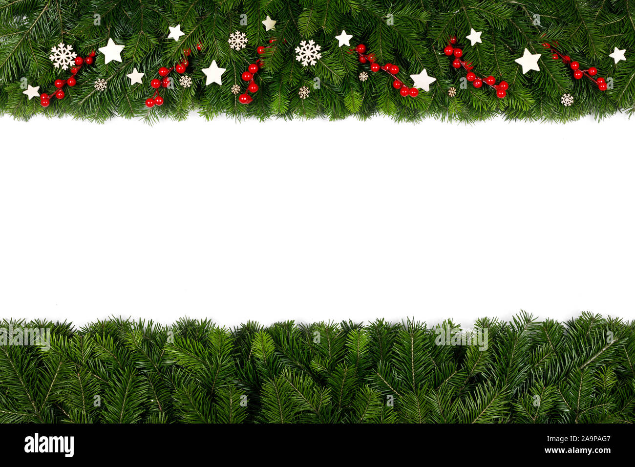 Christmas Border frame of tree branches and red berries and wooden ...