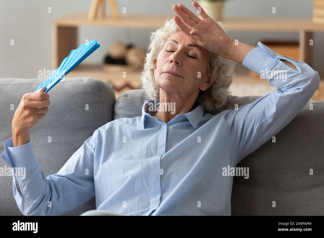 Tired woman fan relieve hi-res stock photography and images - Alamy