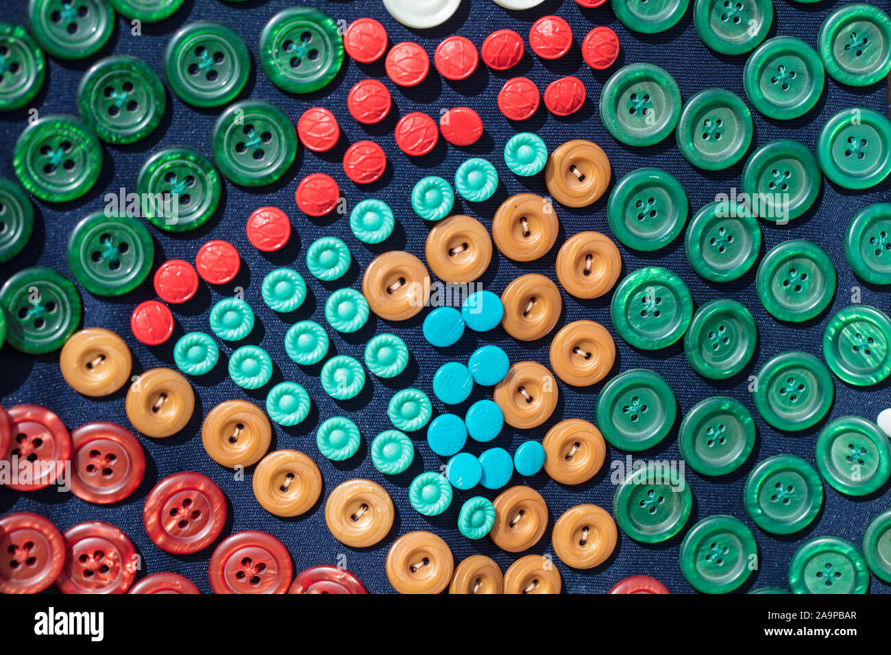 Background many buttons on the fabric Stock Photo - Alamy