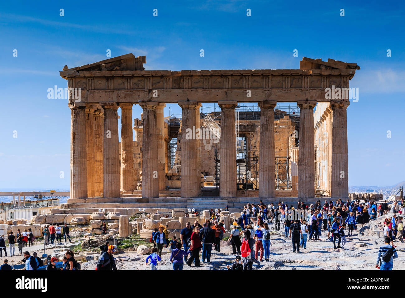 Athens, Greece - November 3, 2018: Tourists at the famous Acropolis Hill enjoying Parthenon ...