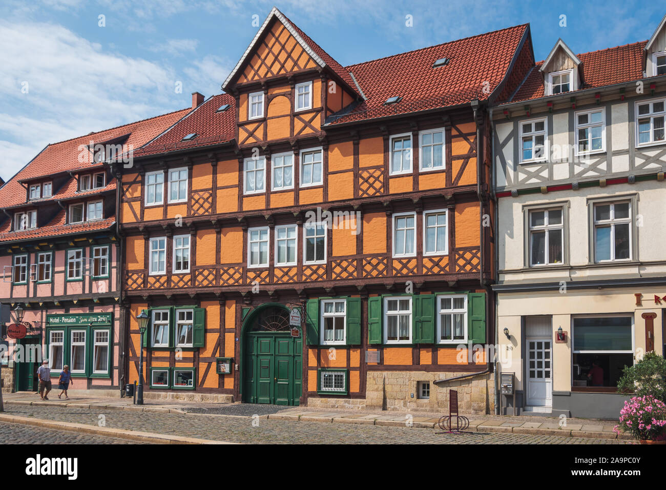View of pavement street with traditional colorful half-timbered ...