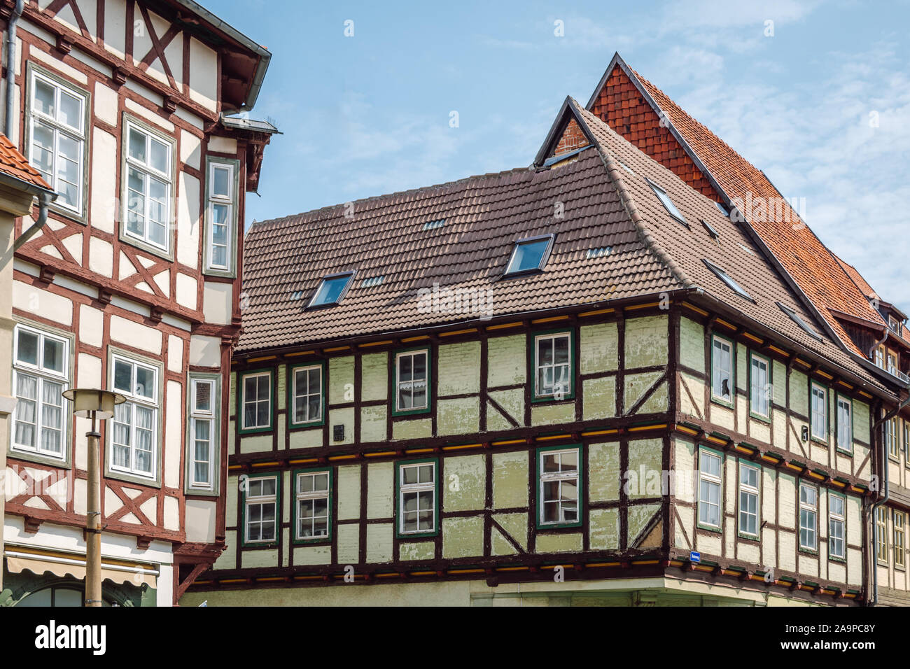 Corner view of the facade of a traditional half-timbered house. An ...