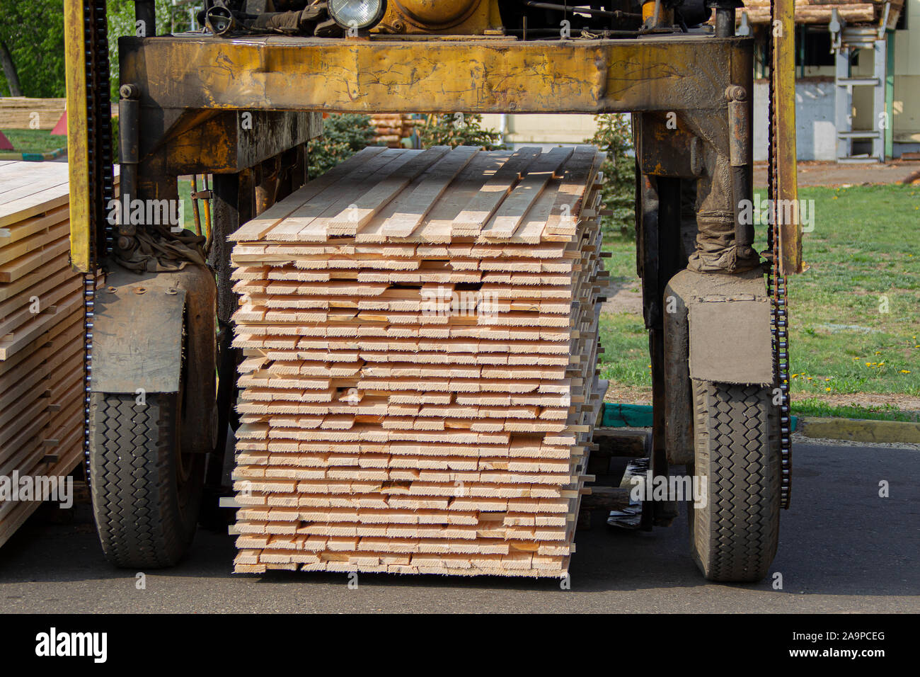 Loader with boards. Wood processing industry. Wood processing plant ...