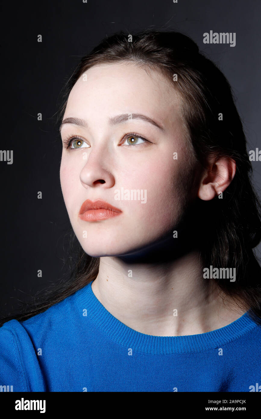 Close-up portrait of a young girl. Face of a twenty year old woman ...