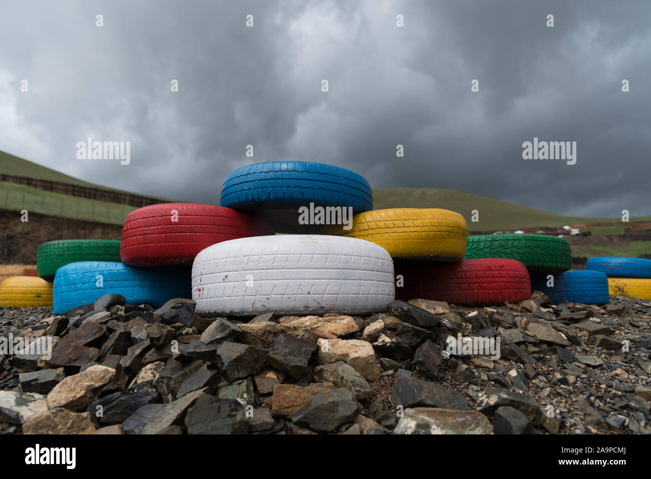 Coloured tyres in front of a school in Mongolia Stock Photo - Alamy