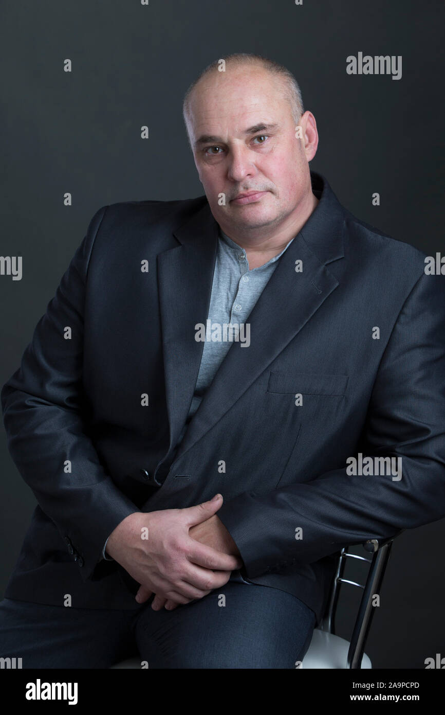 Studio portrait of an ordinary middle-aged man in a suit Stock Photo ...