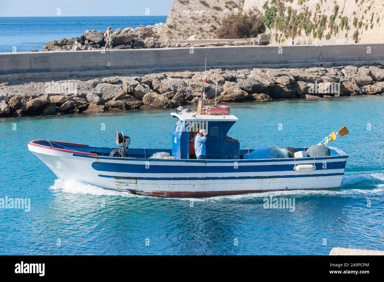 Small fisher boat in navigation in the Ionian Sea Stock Photo - Alamy