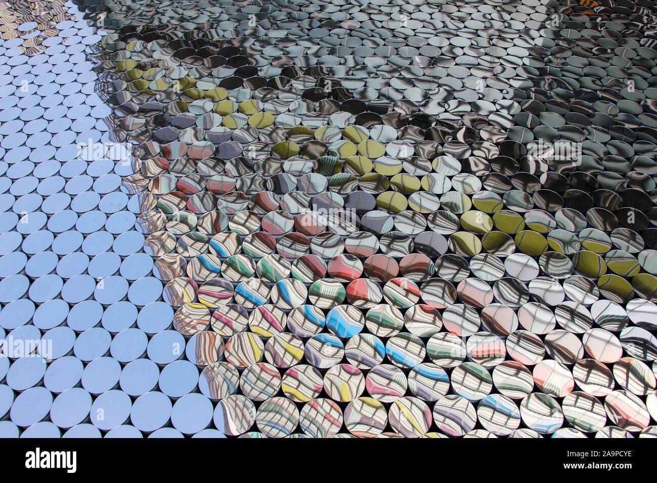 Abstraction from aluminum cans laid out in rows, with the surrounding ...