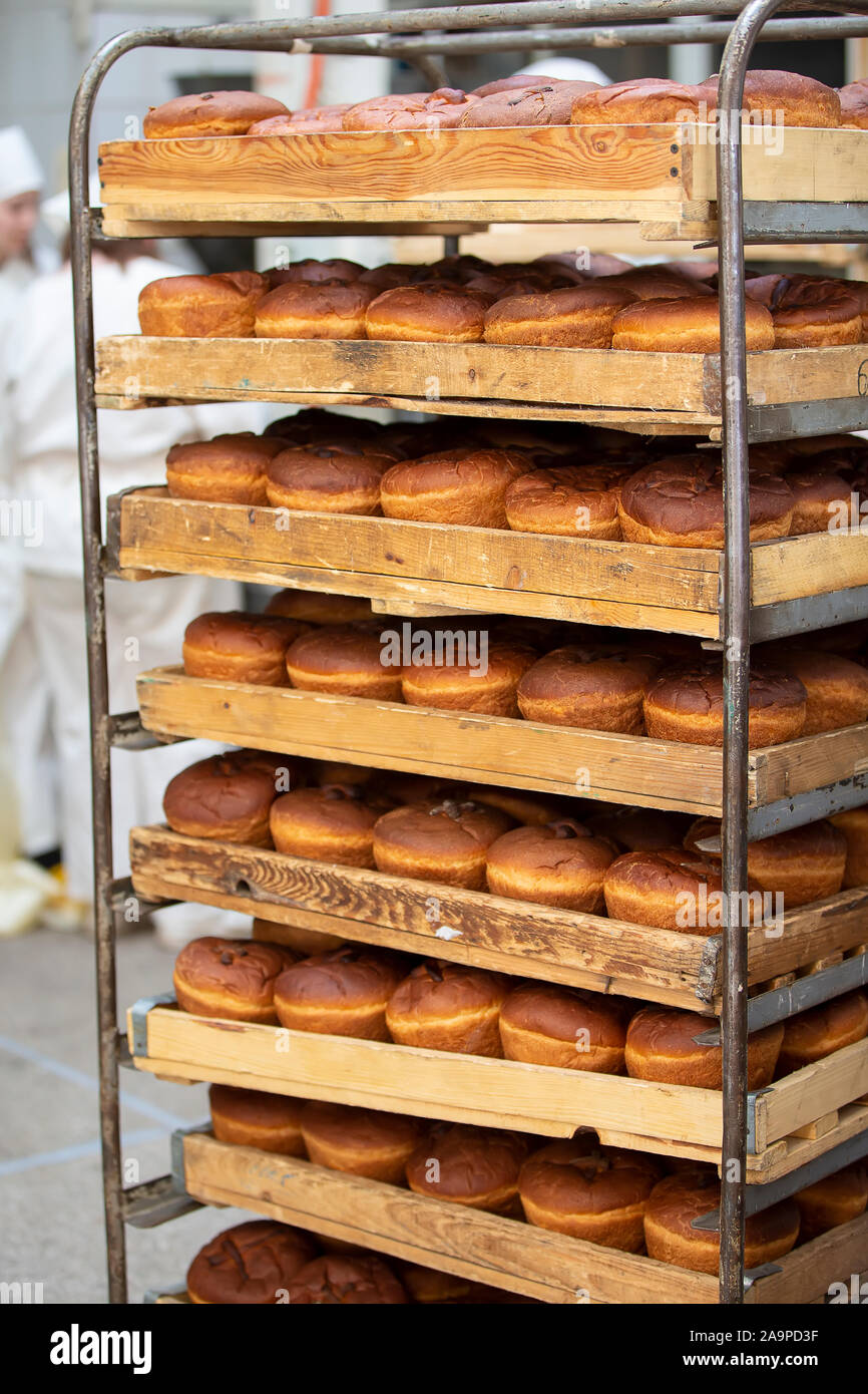 Upright lots of bread on pallets. Industrial production of bread Stock ...