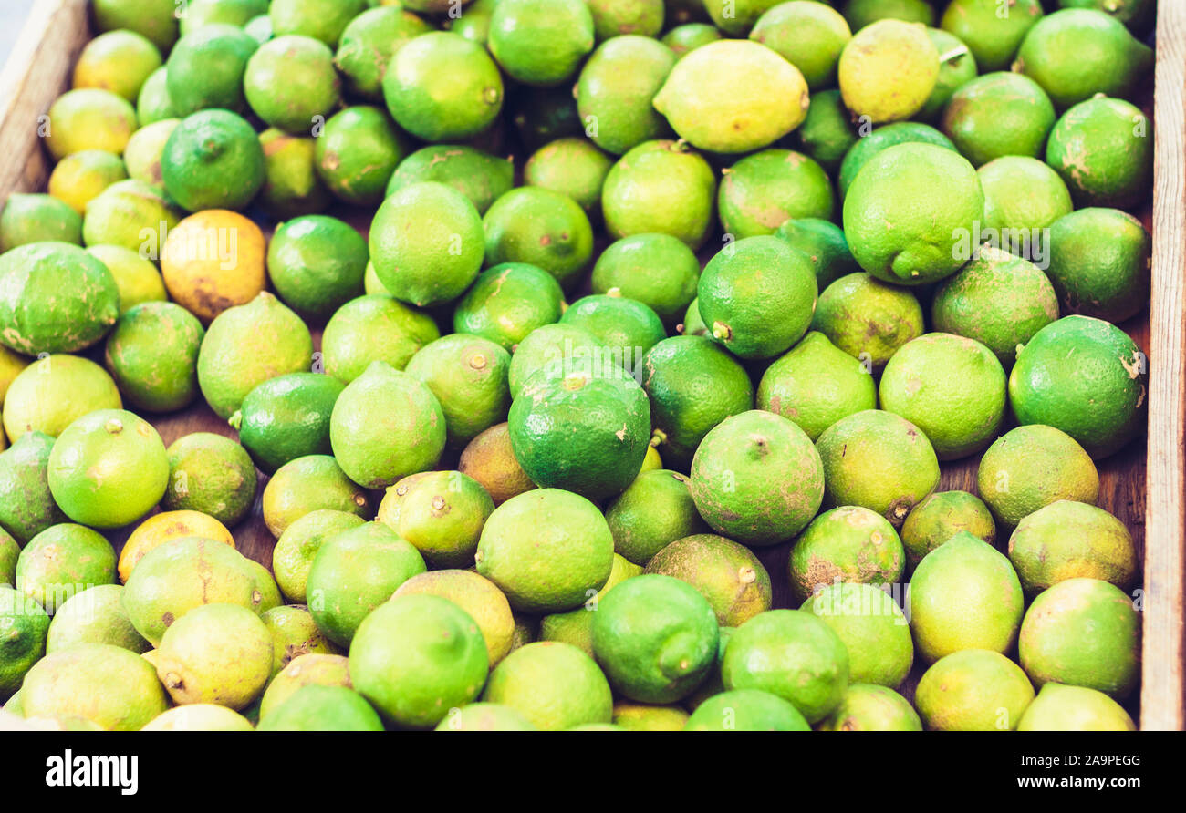 various colorful fresh fruits limes, in the fruit market, Catania ...
