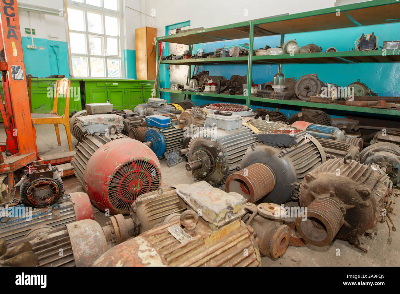 Wood processing plant. Old electric motors from industrial machines ...