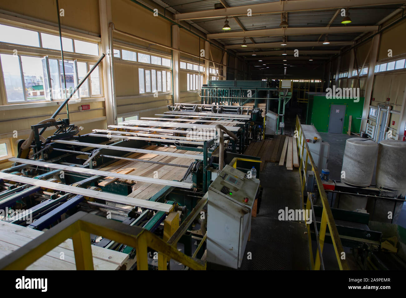 Wood processing plant. Wood cutting workshop Stock Photo - Alamy