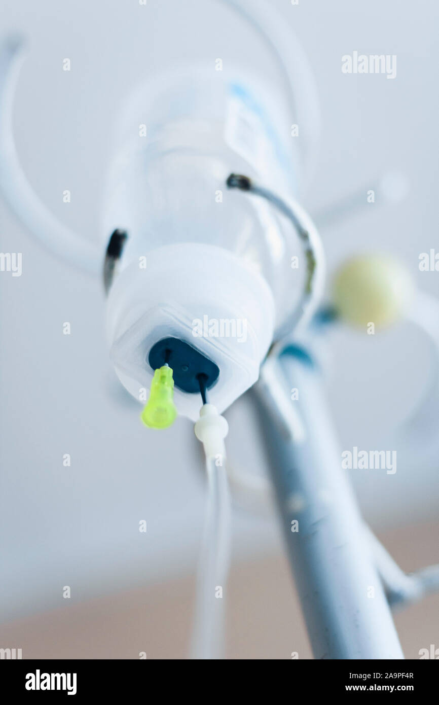 Close-up bottle of medicine on dropper system in the operating room ...