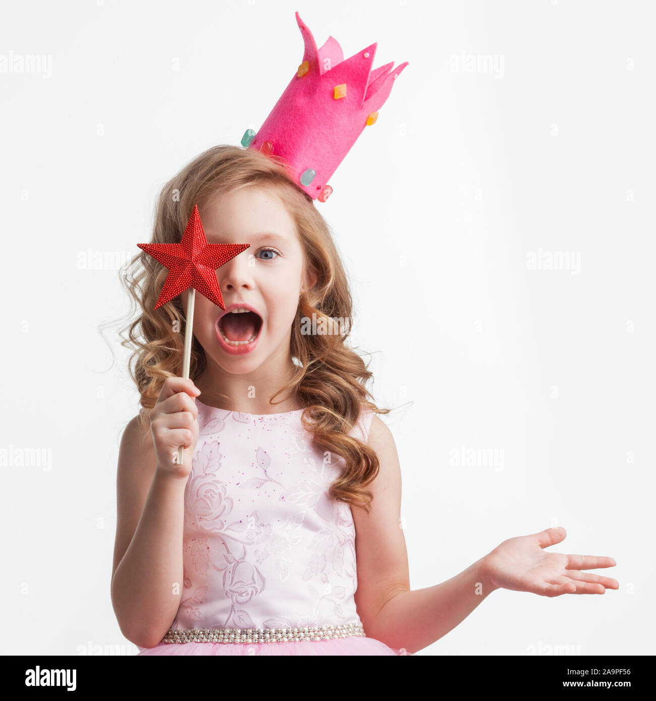 Beautiful little candy princess girl in crown holding star shaped magic ...