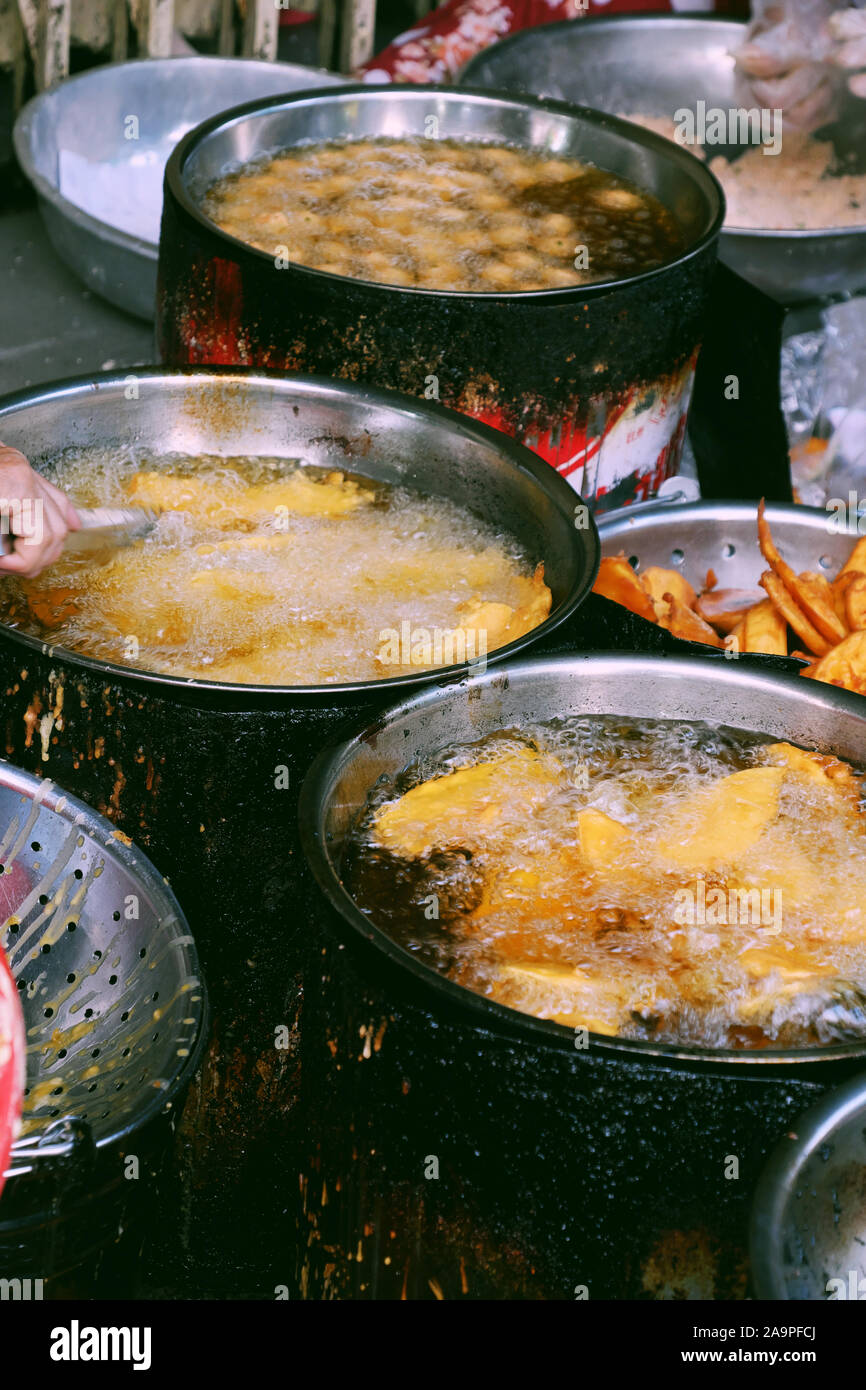 Vietnamese outdoor food street at Ho Chi Minh city in evening, tray of ...
