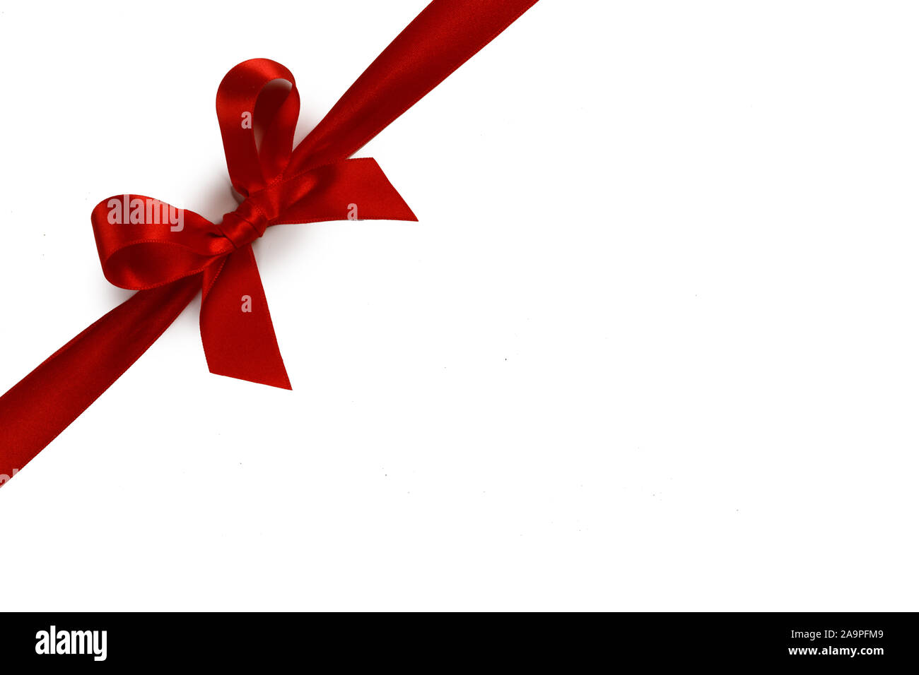 Elegant satin red ribbon bow isolated on white background Stock Photo ...
