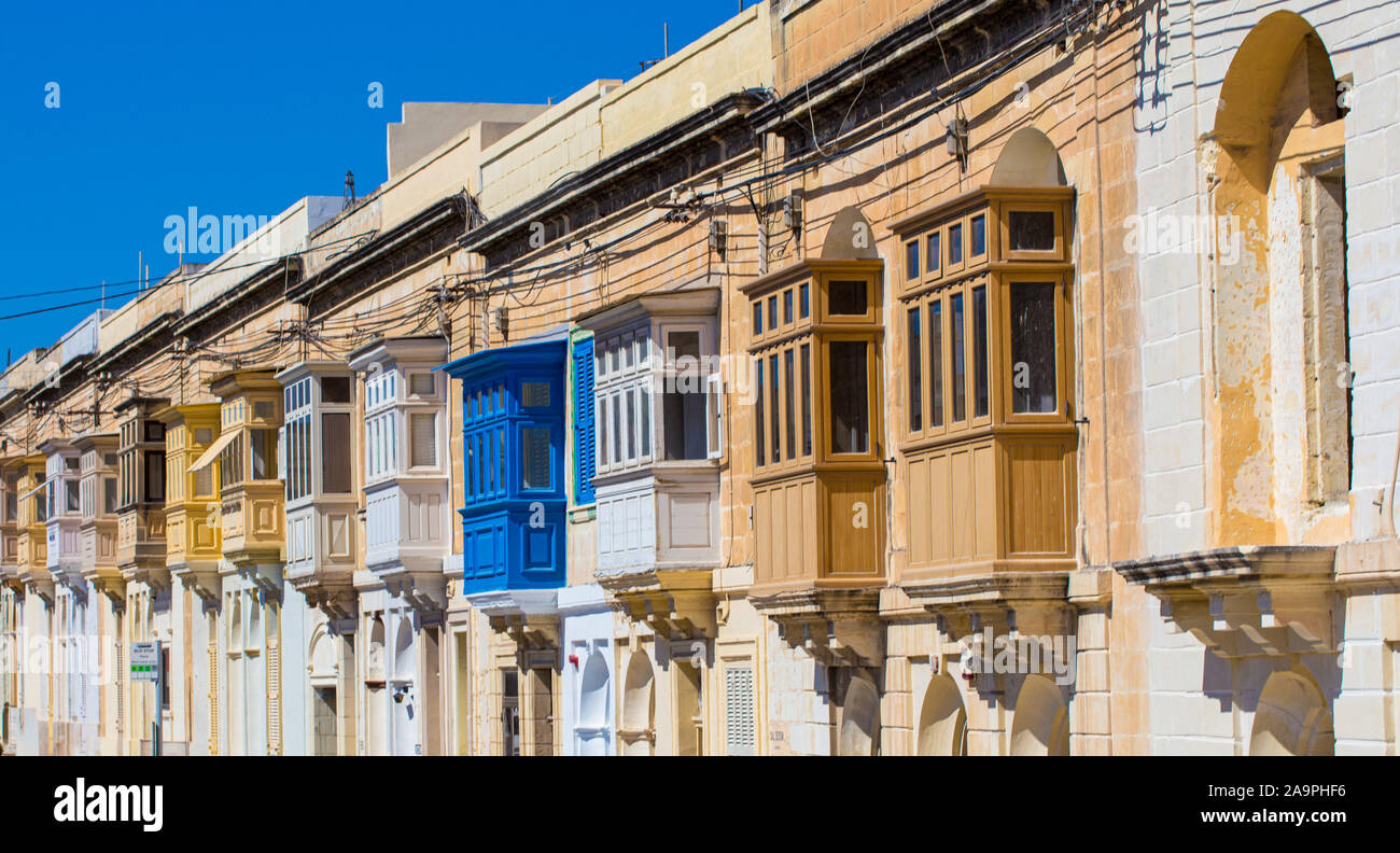 Traditional colorful maltese balconies in row, Valletta, Malta Stock ...