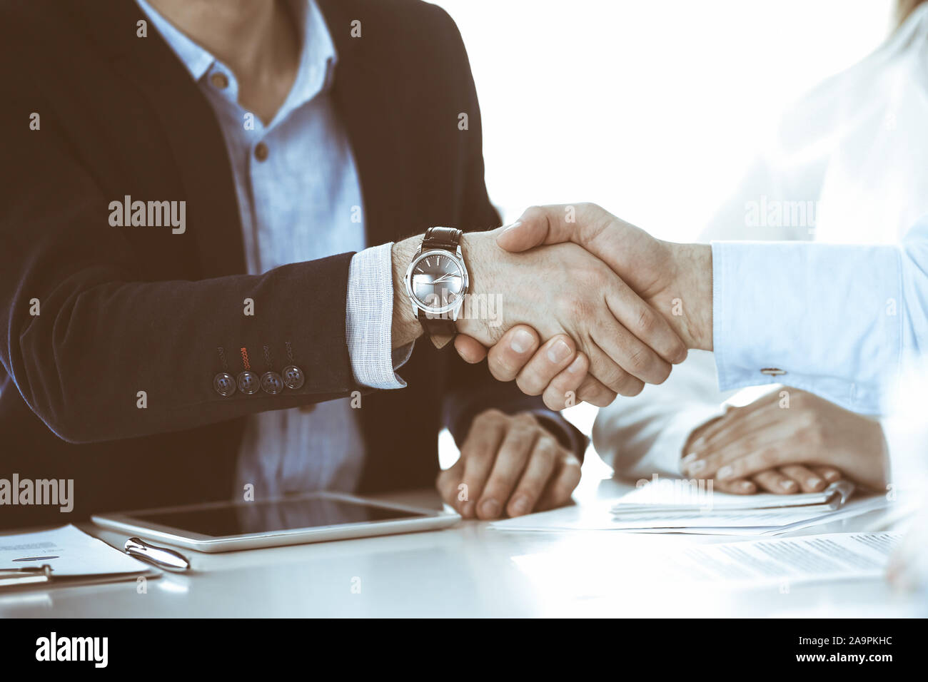 Business people shaking hands at meeting or negotiation, close-up ...