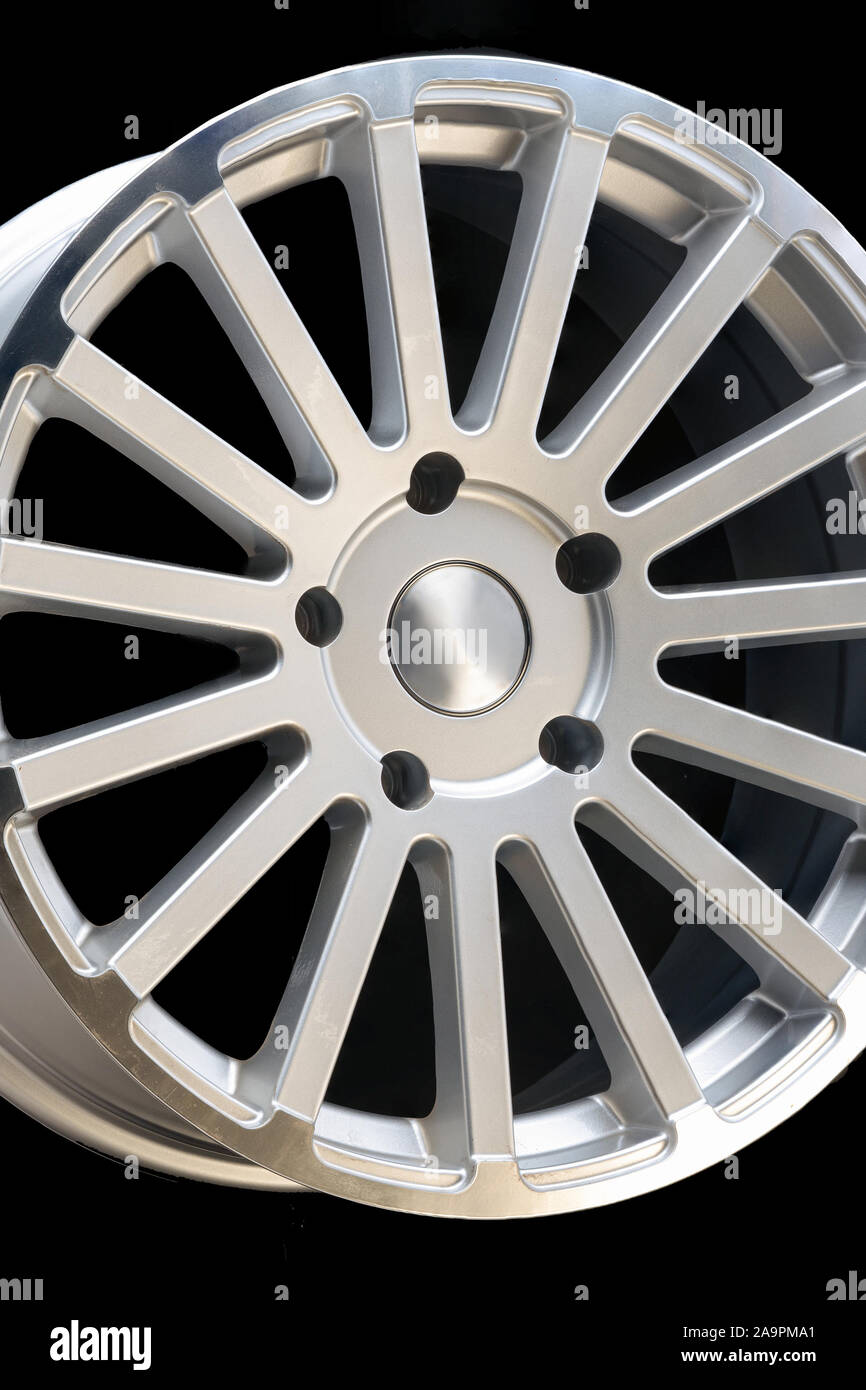 multi-spoke silver wheel, close-up on a black background Stock Photo ...