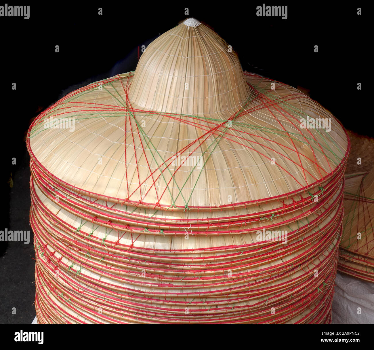 Handmade hats made from bamboo are on sale at an outdoor market Stock ...