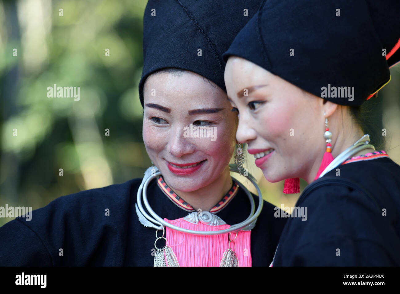 Mengla, China. 17th Nov, 2019. Women of the Yao ethnic group are seen ...