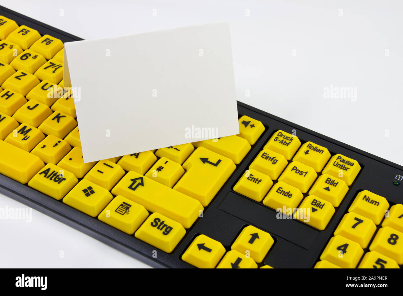 Yellow keyboard with label background close-up Stock Photo - Alamy