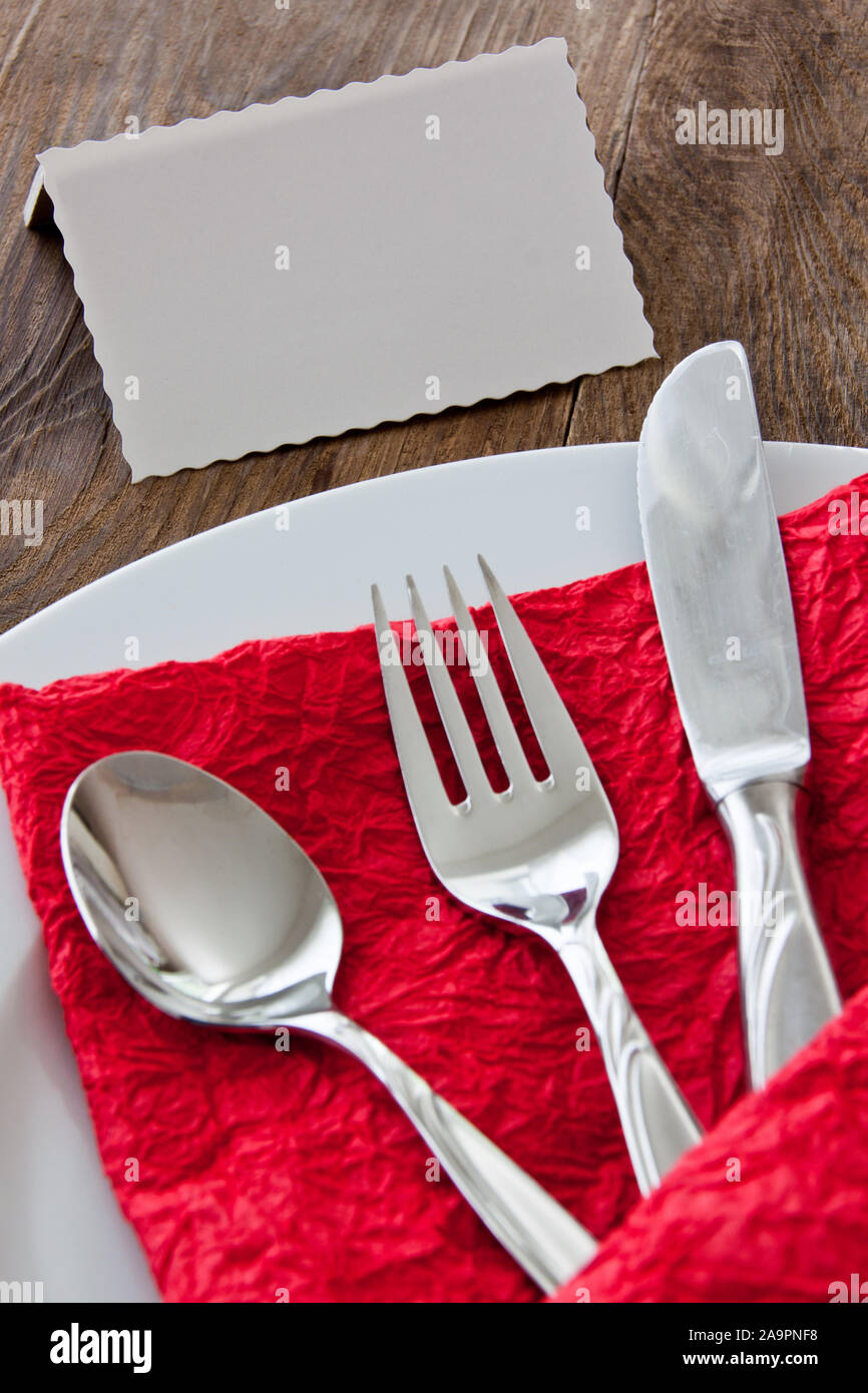 Plate and cutlery with label Stock Photo - Alamy