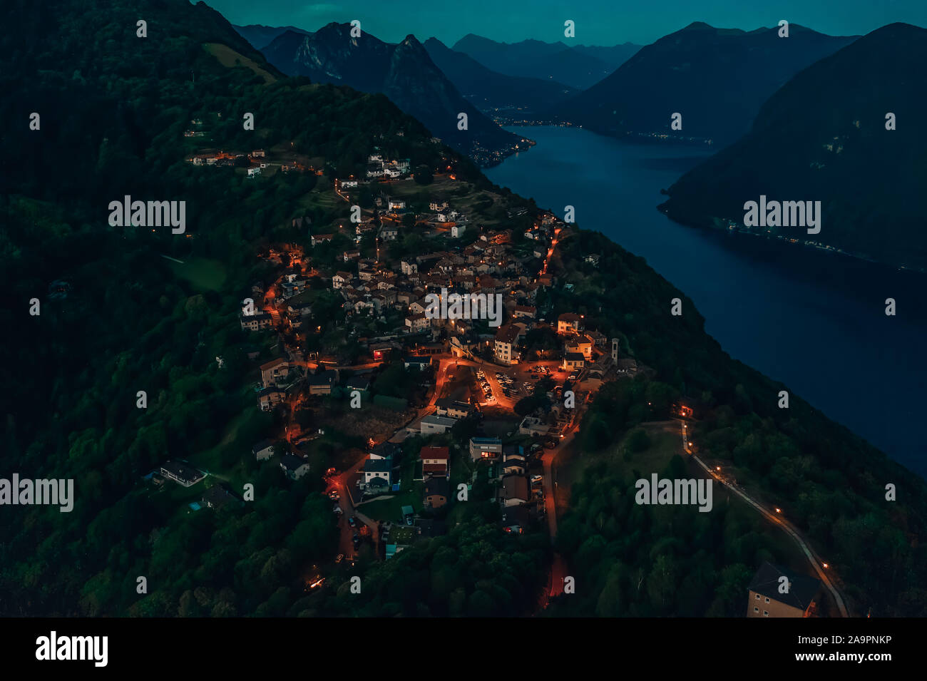 Aerial drone shot view of Bre Sopra, swiss village on Monte Bre in ...