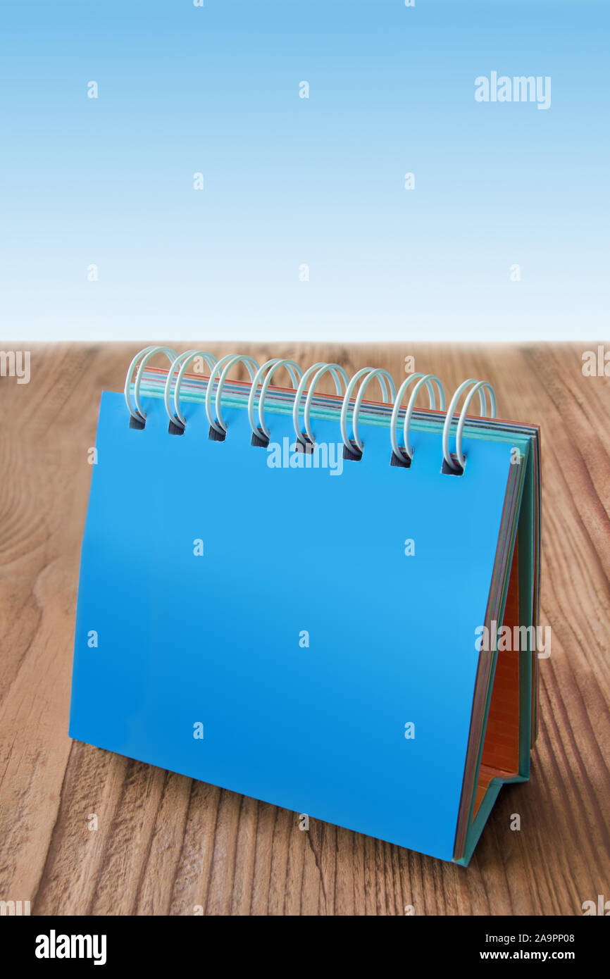Folding calendar with copy space on wooden background Stock Photo - Alamy