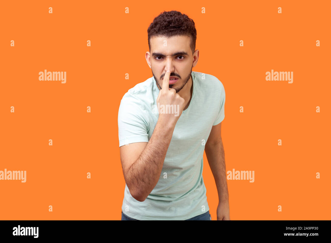 You are liar. Portrait of angry brunette man with beard in casual white ...