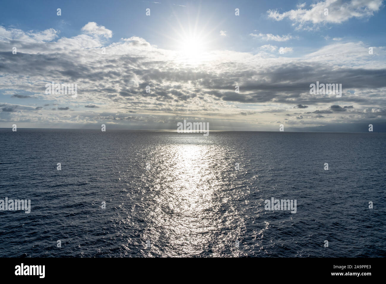 sunset on the sea with beautiful cloud patterns, sun rays, ship Stock ...