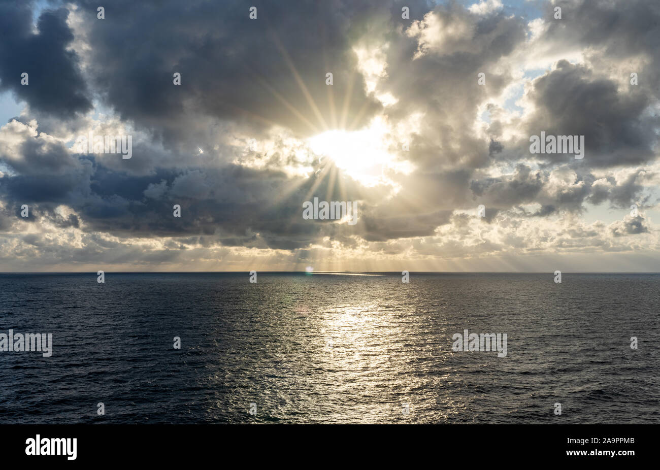 sunset on the sea with beautiful cloud patterns, sun rays, ship Stock ...